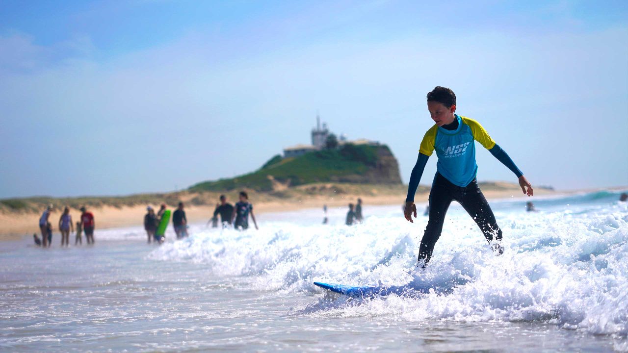 5 Tips to Getting Up on a Surfboard at Nobbys Beach Newcastle ...